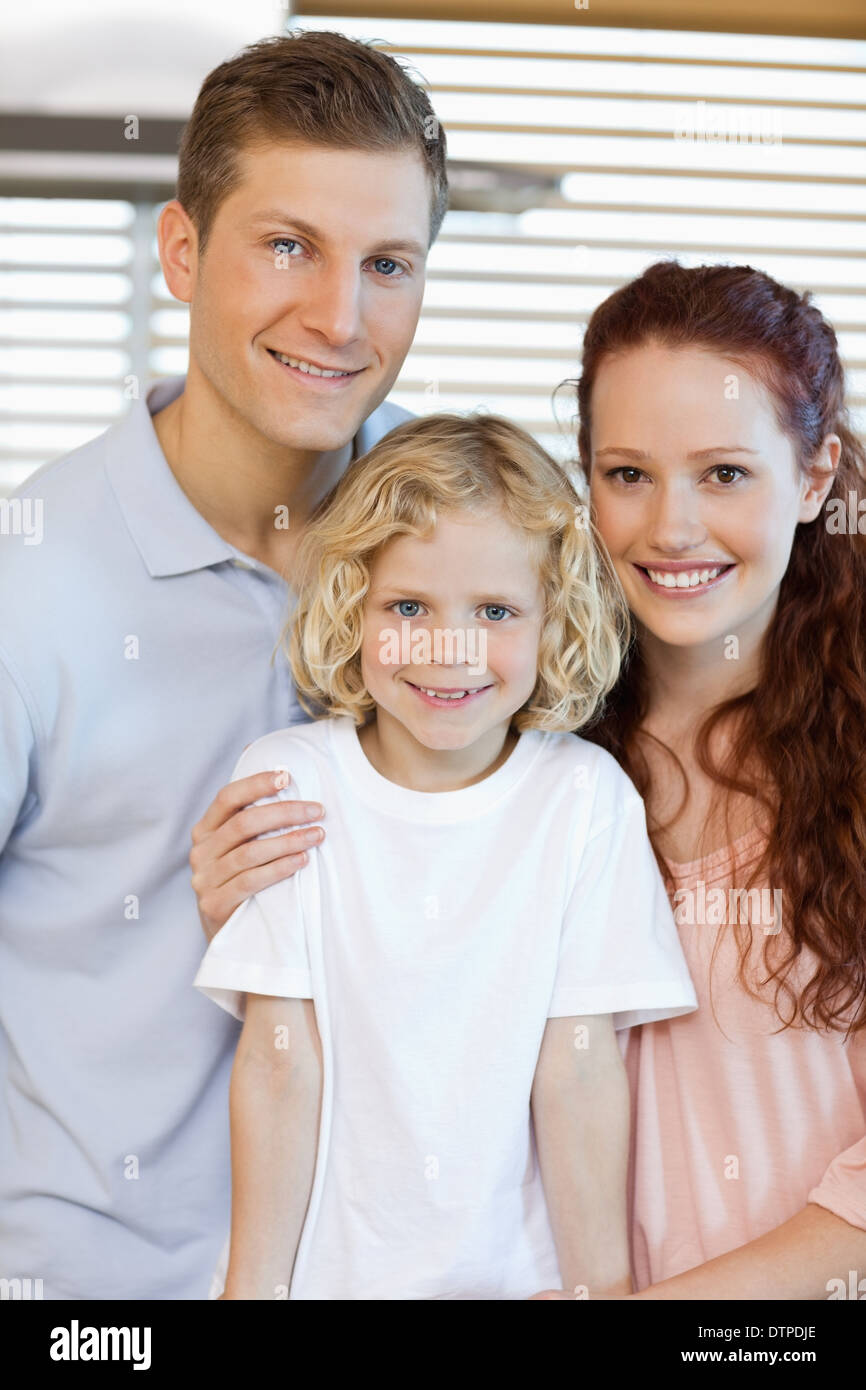 Smiling family standing in the kitchen Stock Photo - Alamy