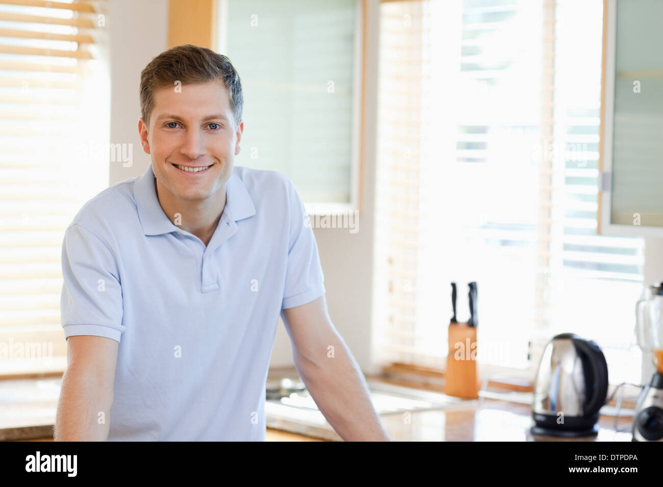 Man standing in the kitchen Stock Photo - Alamy