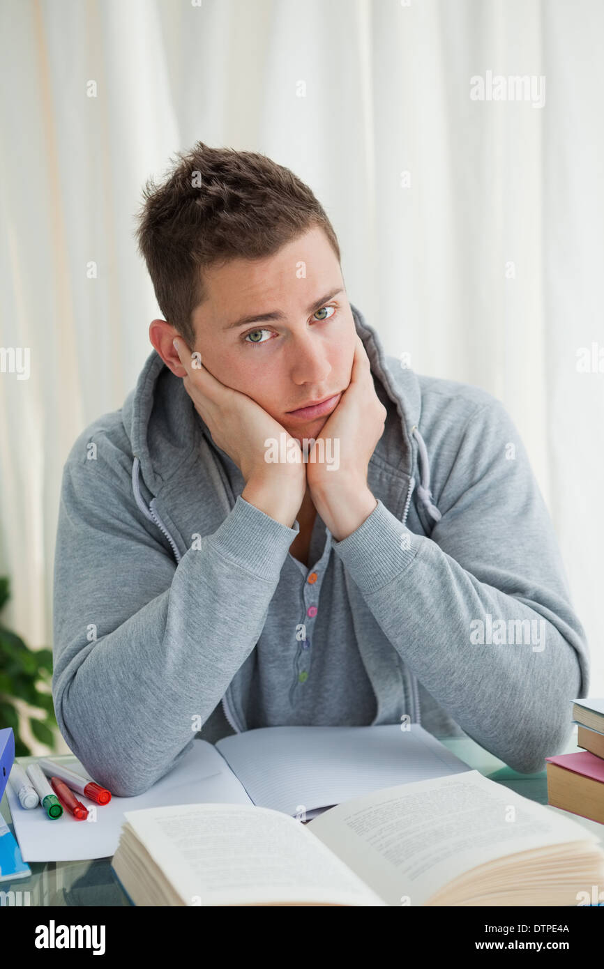 Tired male student Stock Photo - Alamy