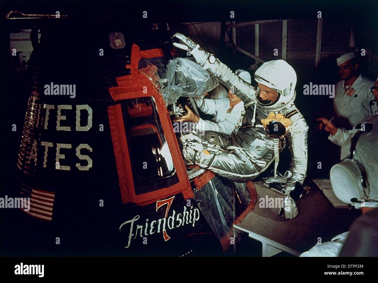 US astronaut John Glenn Jr., pilot of the Mercury Atlas 6, climbs into ...