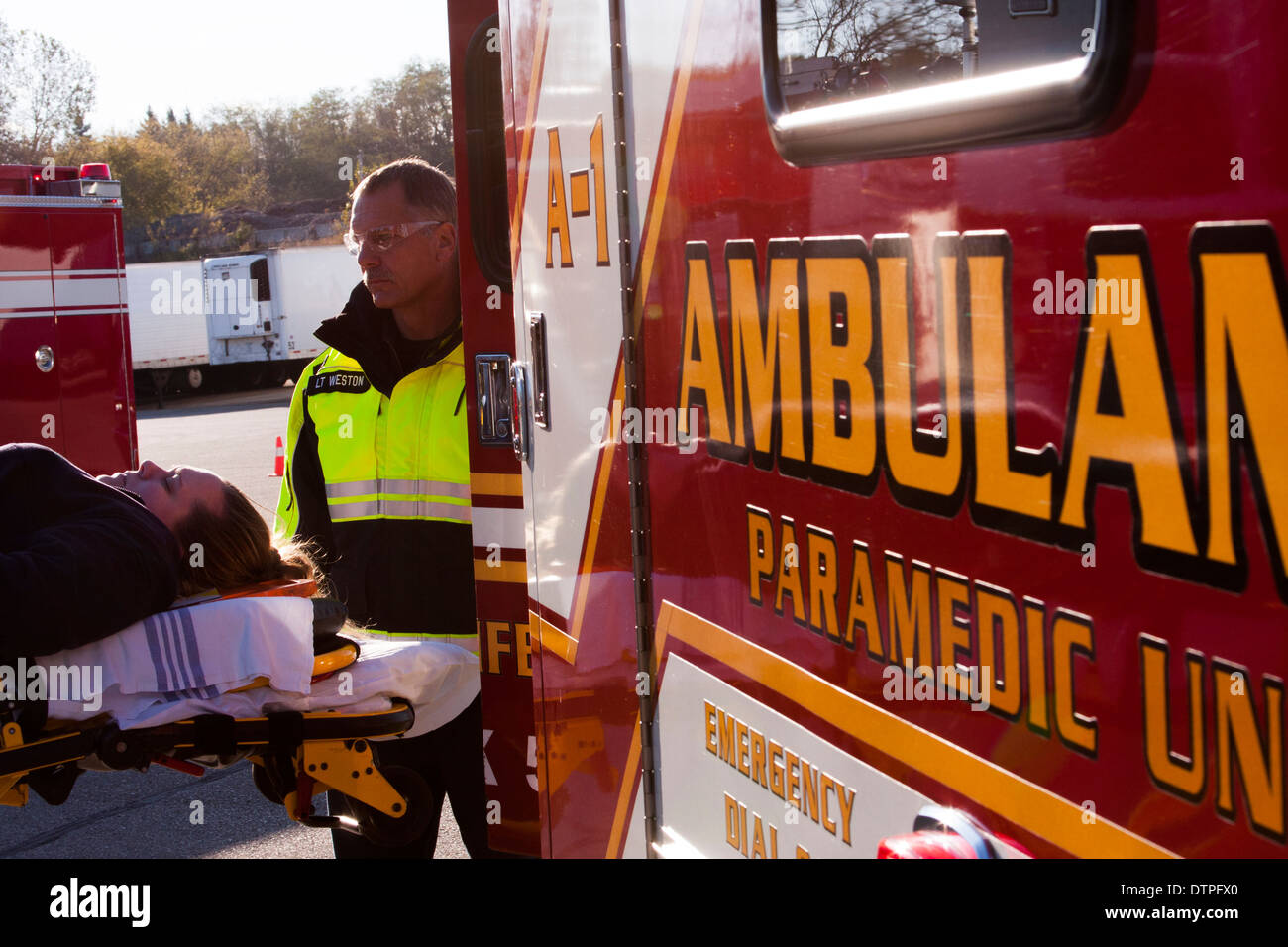 An EMT loading a patient into the back of an Ambulance Stock Photo - Alamy