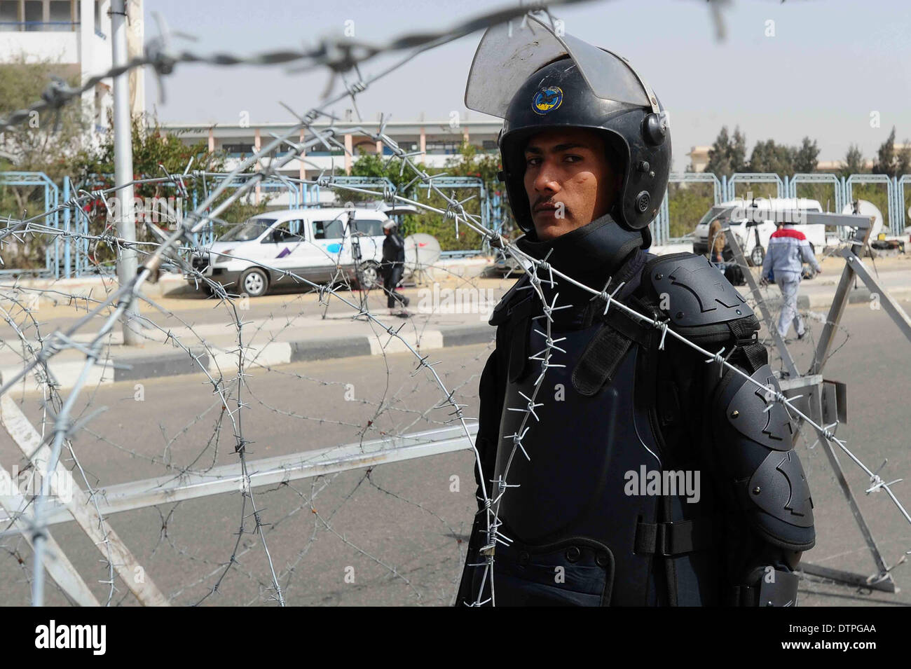 Cairo, Cairo, Egypt. 22nd Feb, 2014. Egyptian security forces stand ...