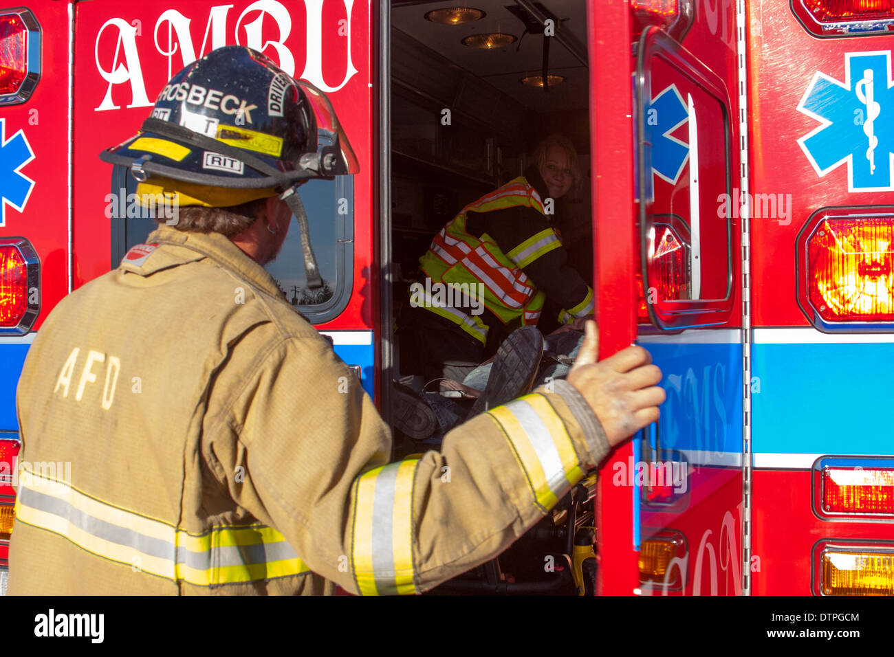 An EMT working on a patient inside an ambulance Stock Photo - Alamy