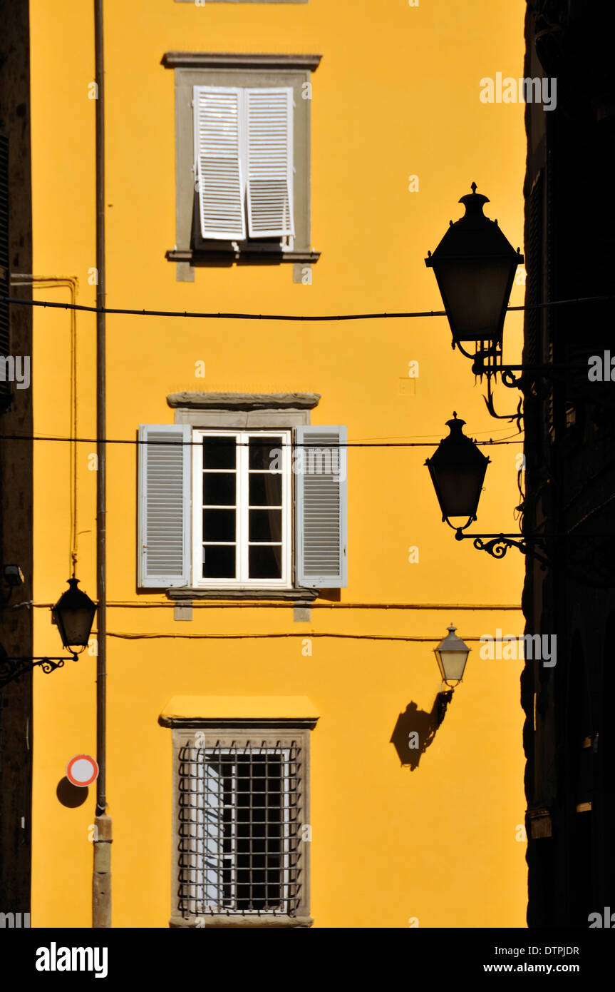 Windows and lanterns on buildings in Luca, Italy Stock Photo - Alamy