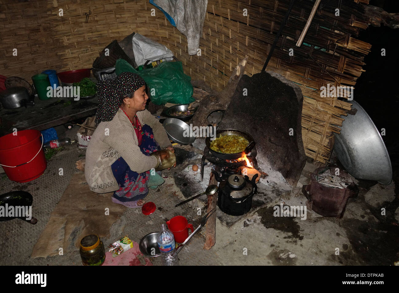 Woman cooking over open fire hi-res stock photography and images - Alamy