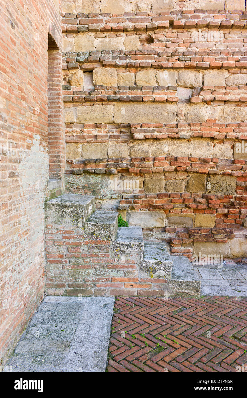 Stone and brick steps, walls and paving of the Duomo, Montepulciano ...