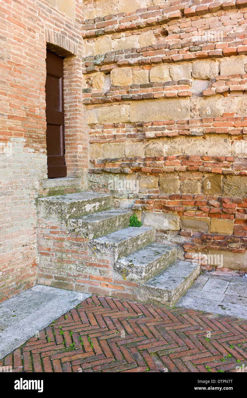 Stone and brick steps, walls and paving of the Duomo, Montepulciano ...