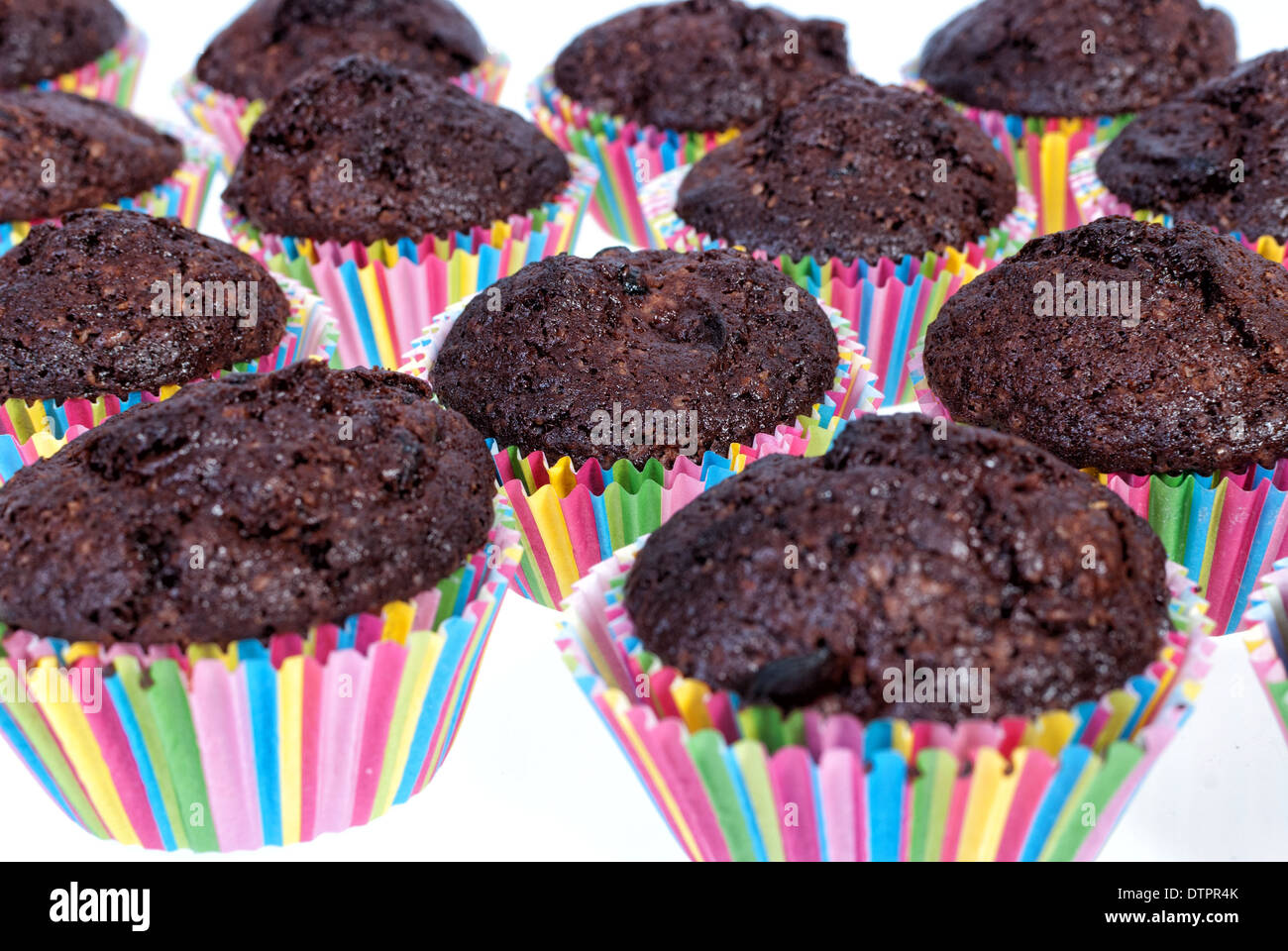 Chocolate muffins in colourful paper for party Stock Photo - Alamy