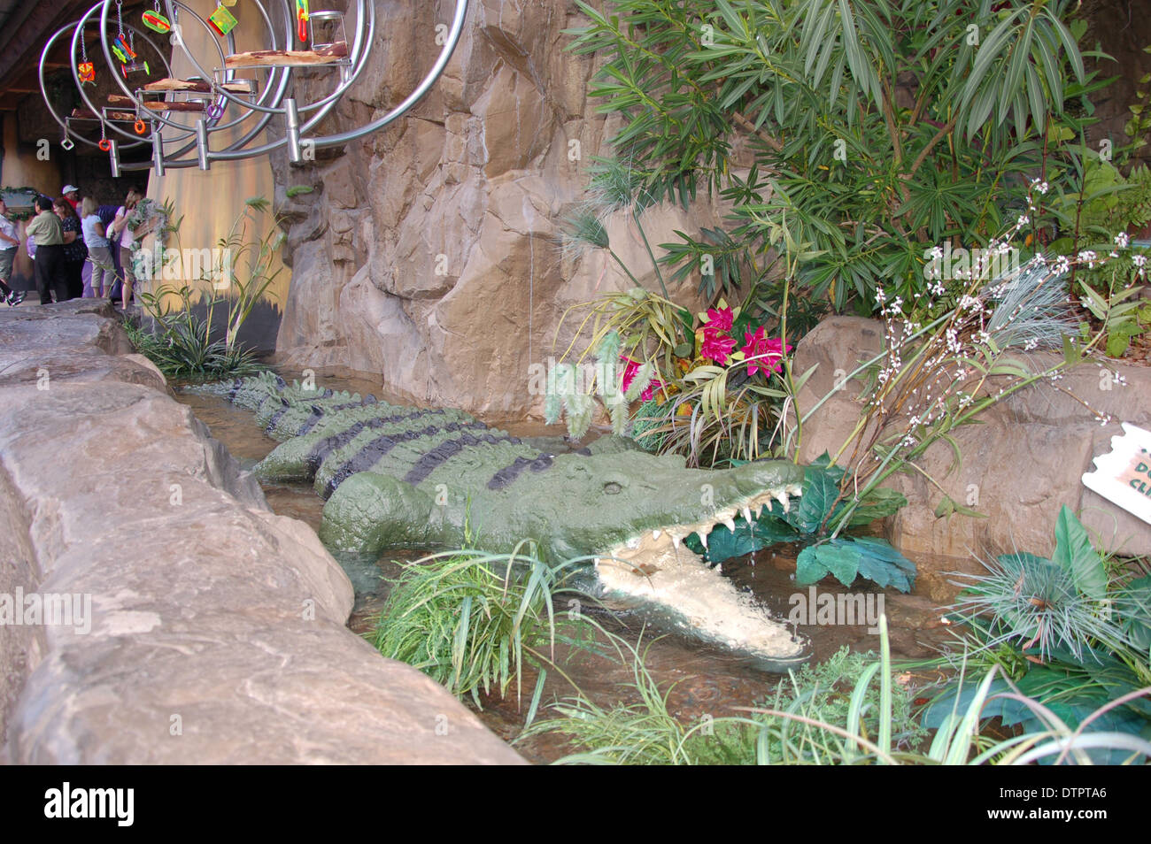 A large model alligator outside the Rainforest Cafe in Downtown Disney ...