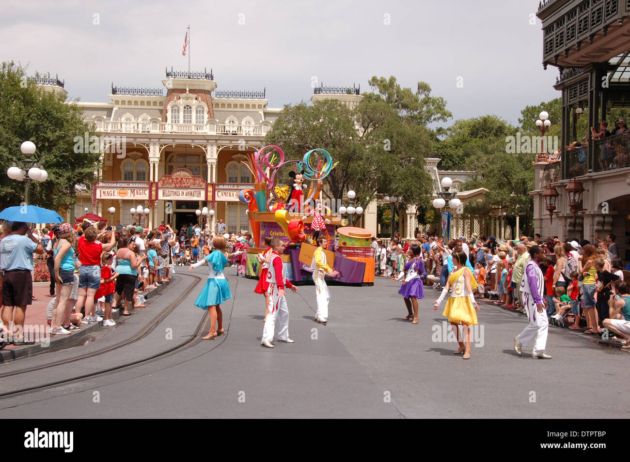 Performers dancing on the streets celebrating A Dream Come True Parade ...