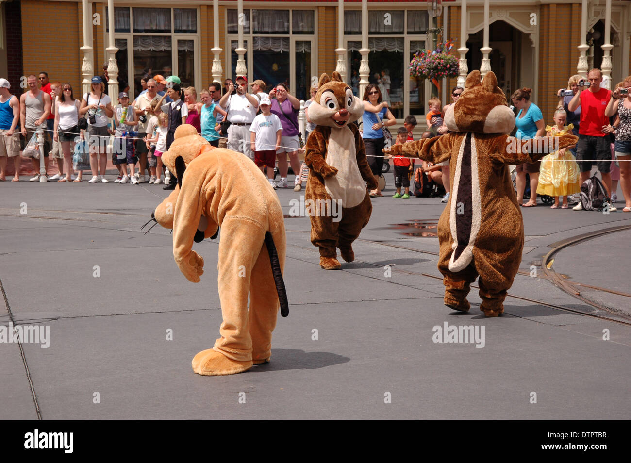 Performers dancing on the streets celebrating A Dream Come True Parade ...