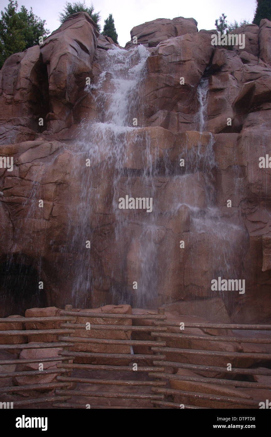 A large water fall at the Canadian Pavilion in Walt Disney's World ...