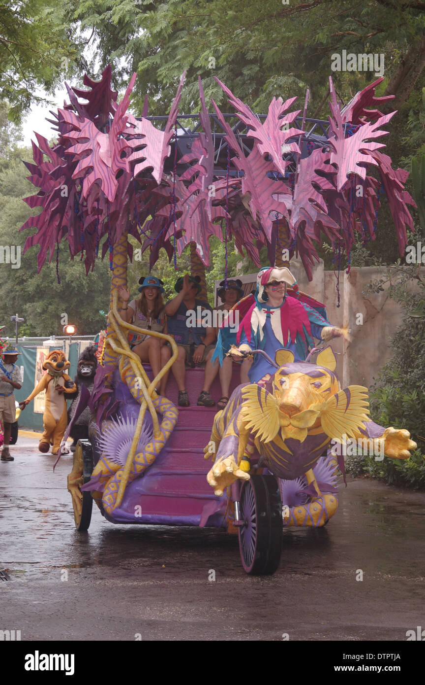 A man riding a tiger looking float parading at Mickey's Jamming Jungle ...
