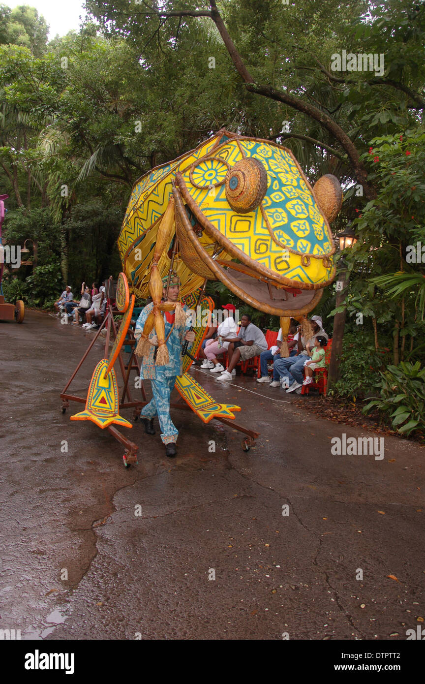 A lizard looking float parading at Mickey's Jamming Jungle Parade in ...