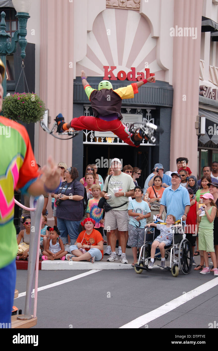 Performers performing at a parade on the streets of Walt Disney's ...