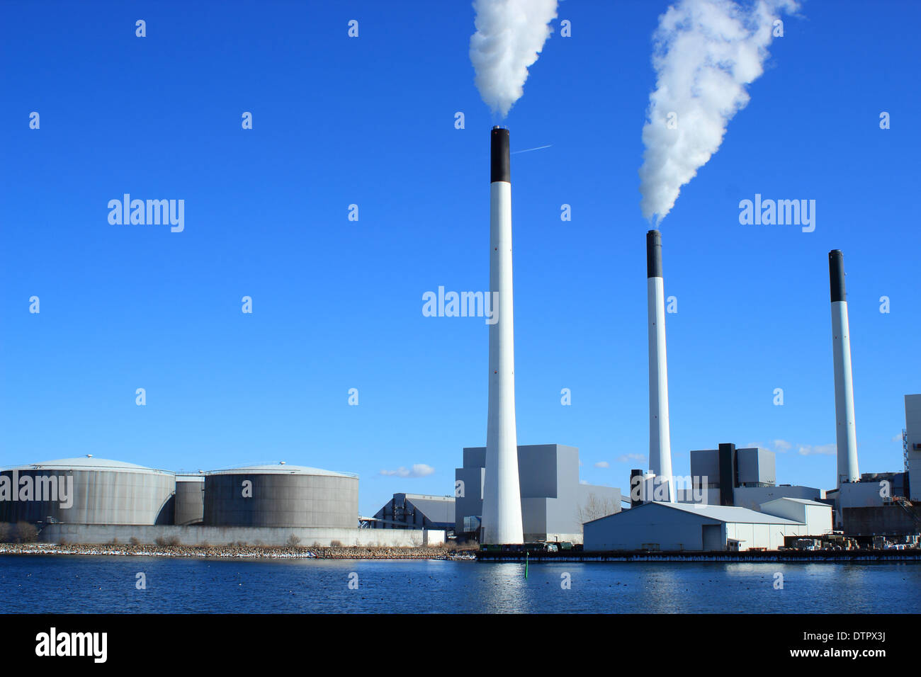 Factory chimneys and gas containers with clouds Stock Photo - Alamy