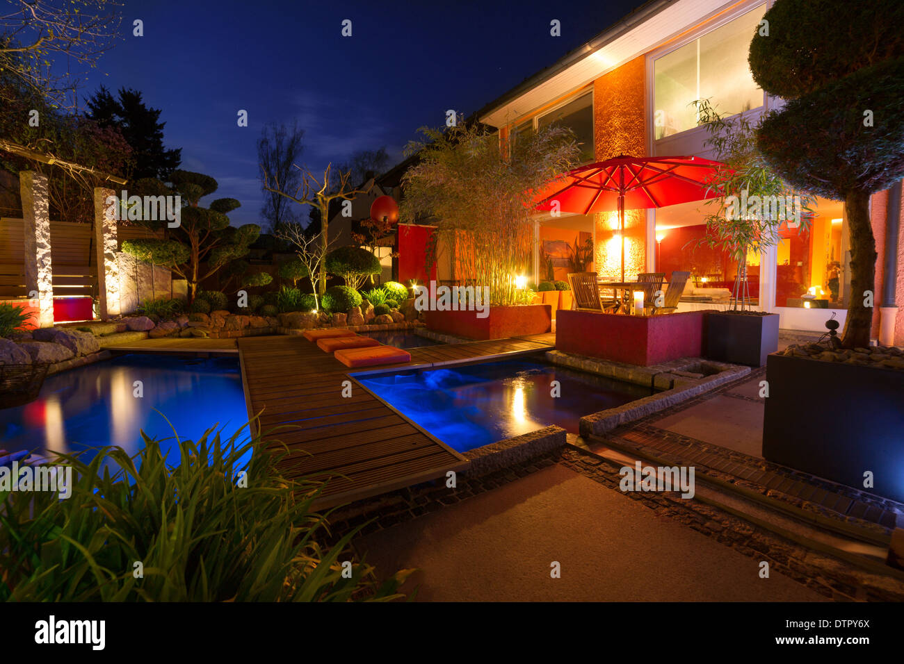 Illuminated Garden at Night Stock Photo - Alamy