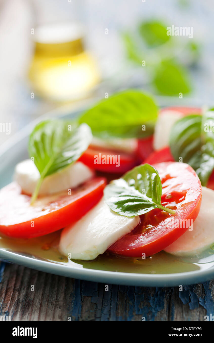 closeup of classic italian caprese salad, with mozzarella,basil and ...