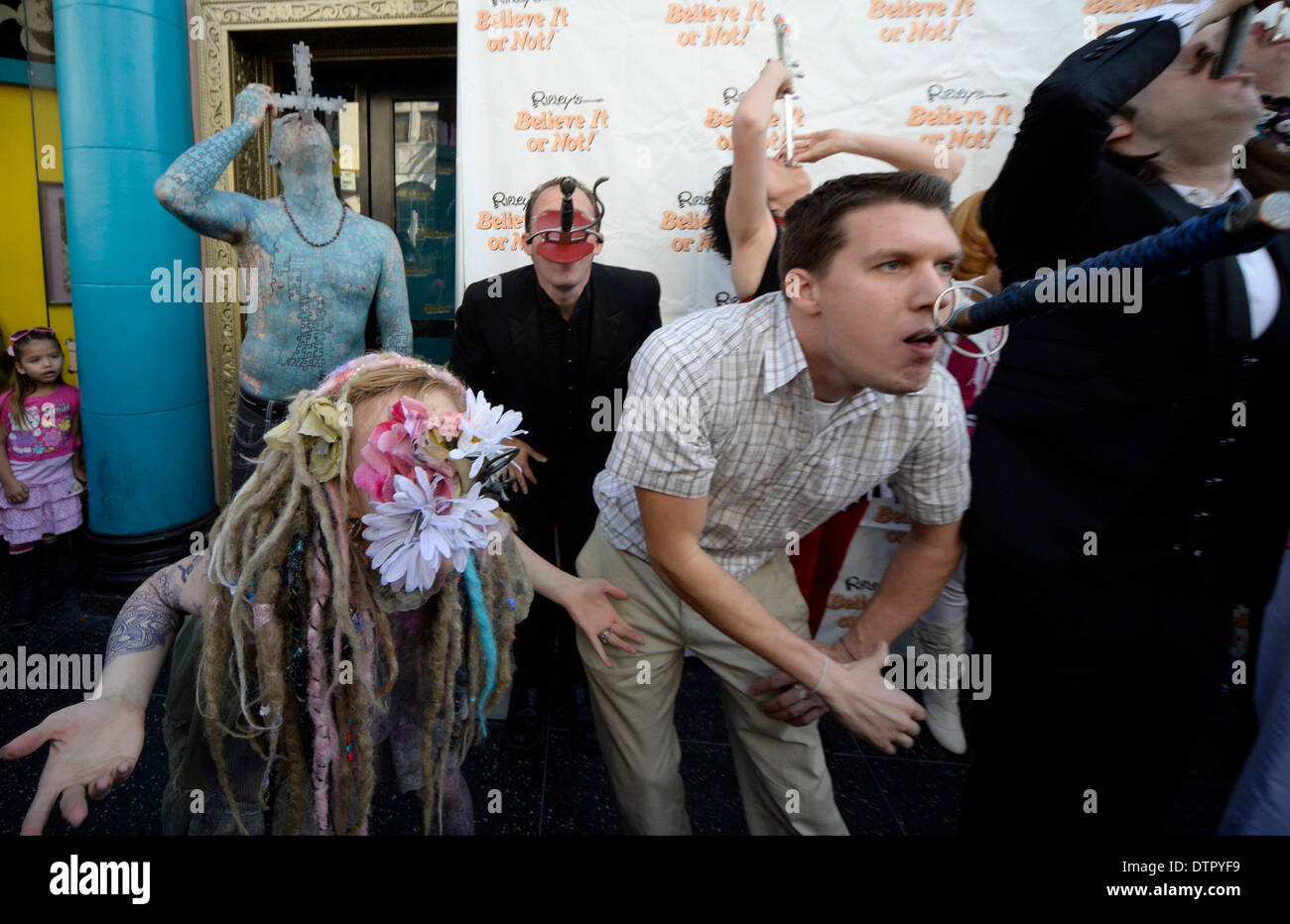 Hollywood CA, USA. 22nd Feb, 2014. A dozen sword swallower perform at ...