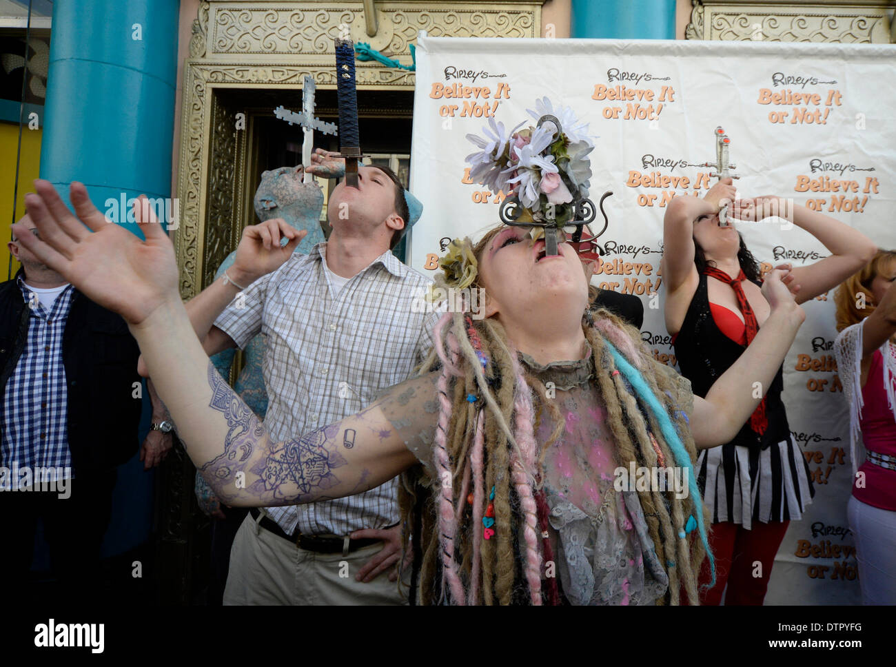 Hollywood CA, USA. 22nd Feb, 2014. A dozen sword swallower perform at ...
