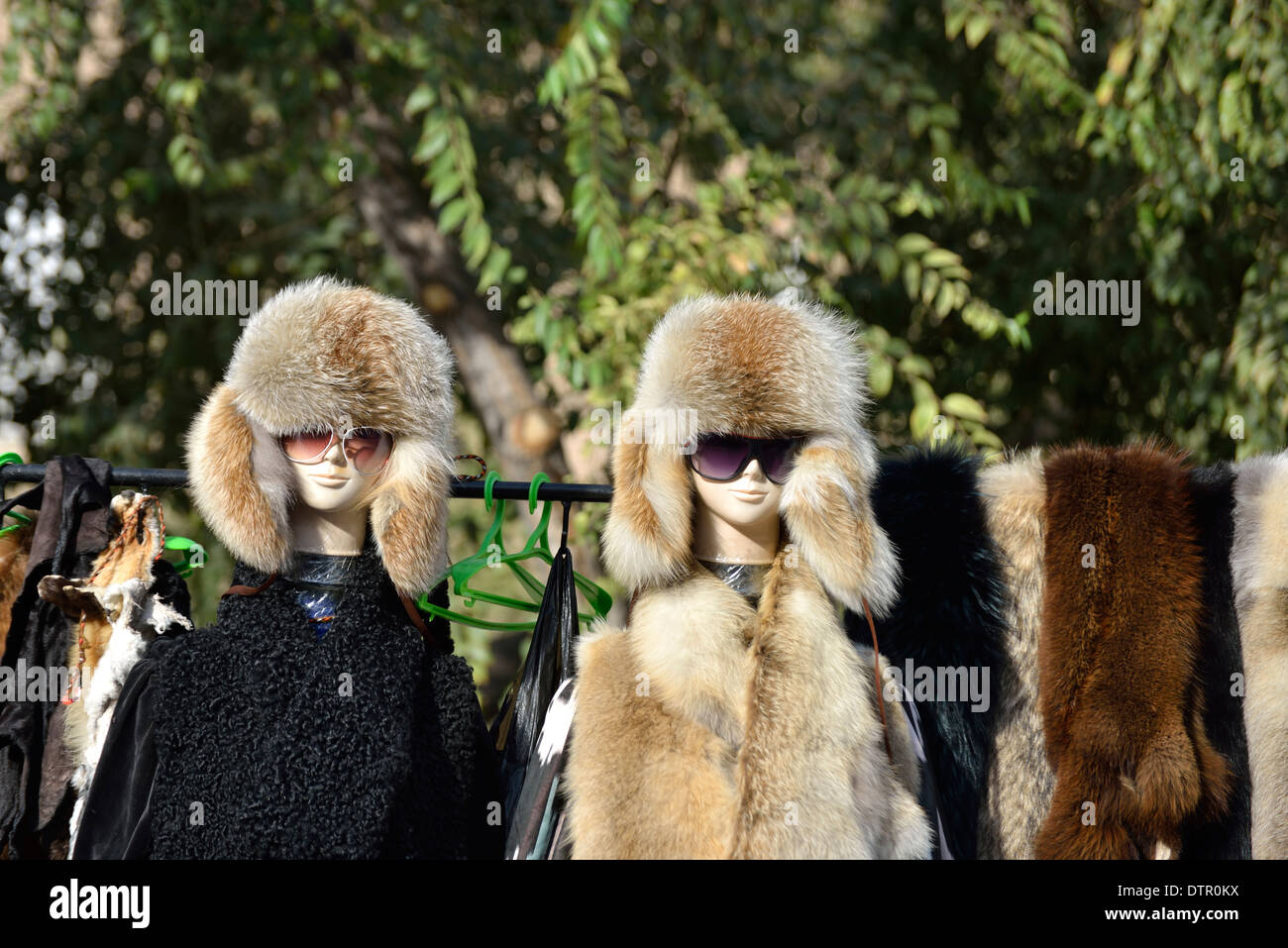 Souvenir stall with fur hats and coats, Khiva, Uzbekistan Stock Photo ...