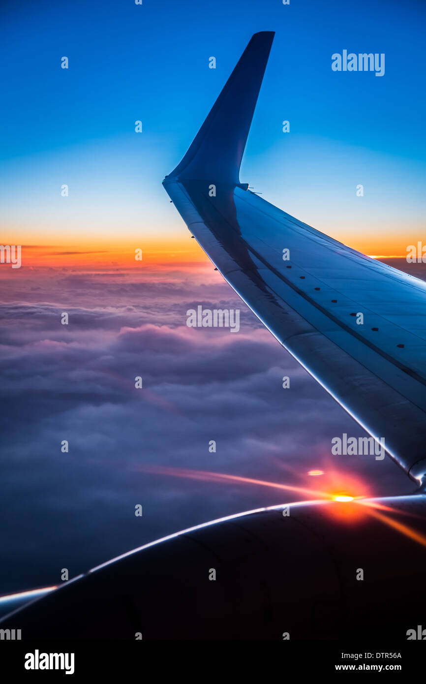 Sunset view from the airplane window Stock Photo - Alamy