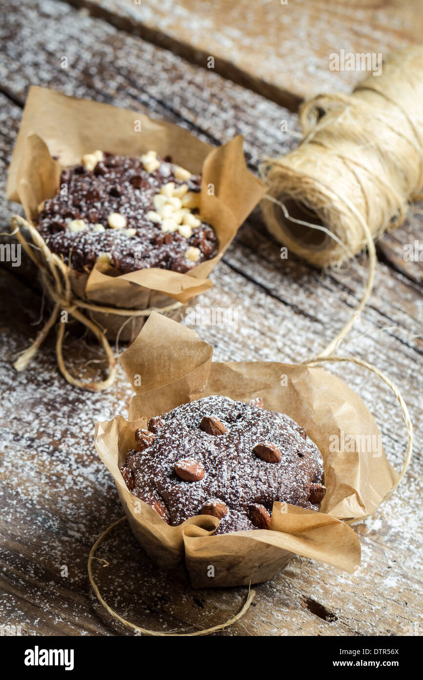 Closeup of decorating chocolate muffins with string Stock Photo - Alamy