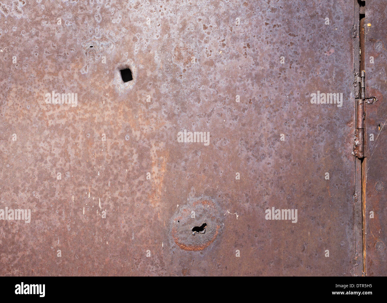 rusty abstract background with holes and loops Stock Photo - Alamy