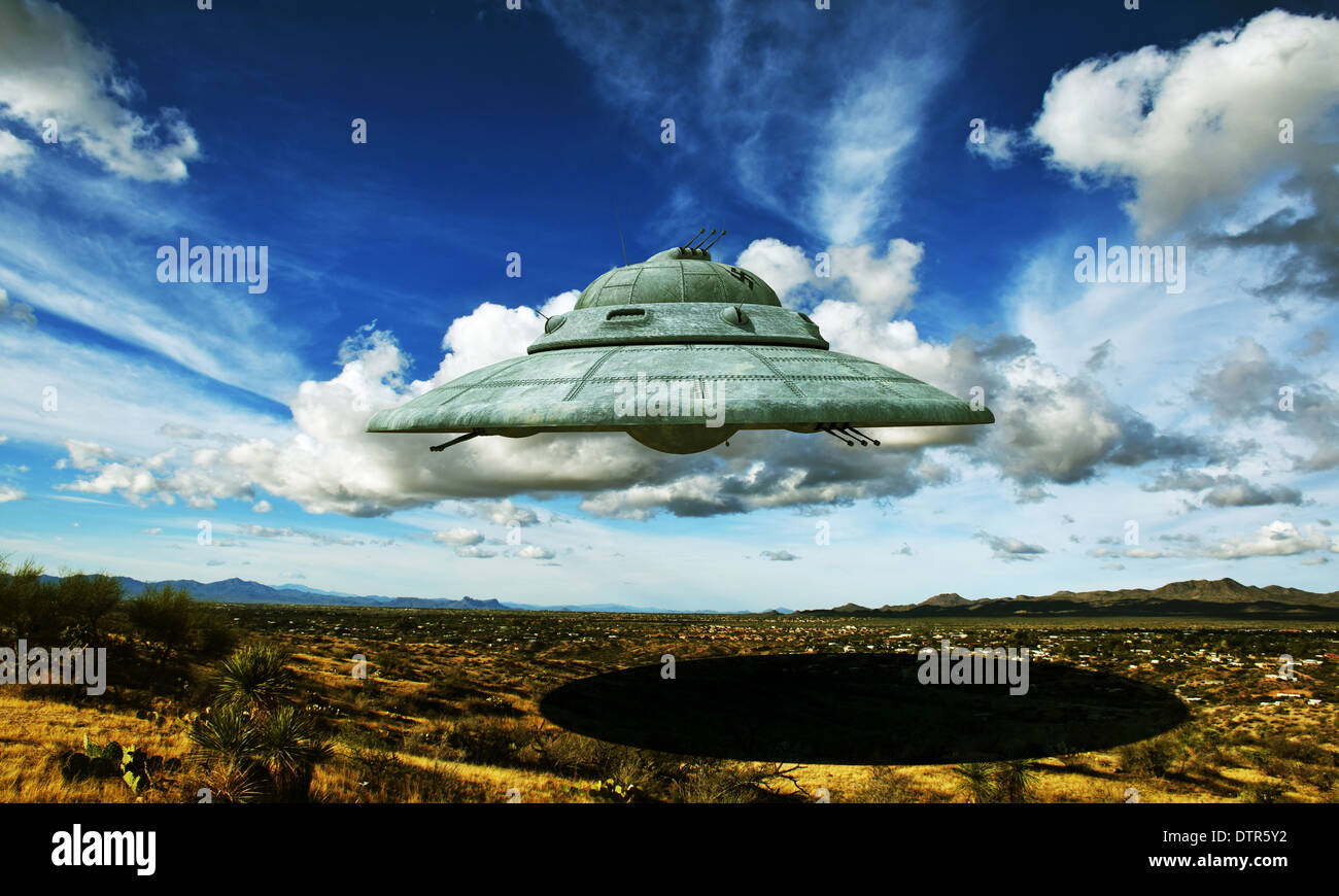 nazi ufo Haunebu flying over the desert Stock Photo - Alamy
