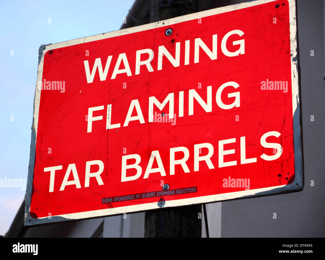 A warning sign "Flaming Tar Barrels Stock Photo - Alamy