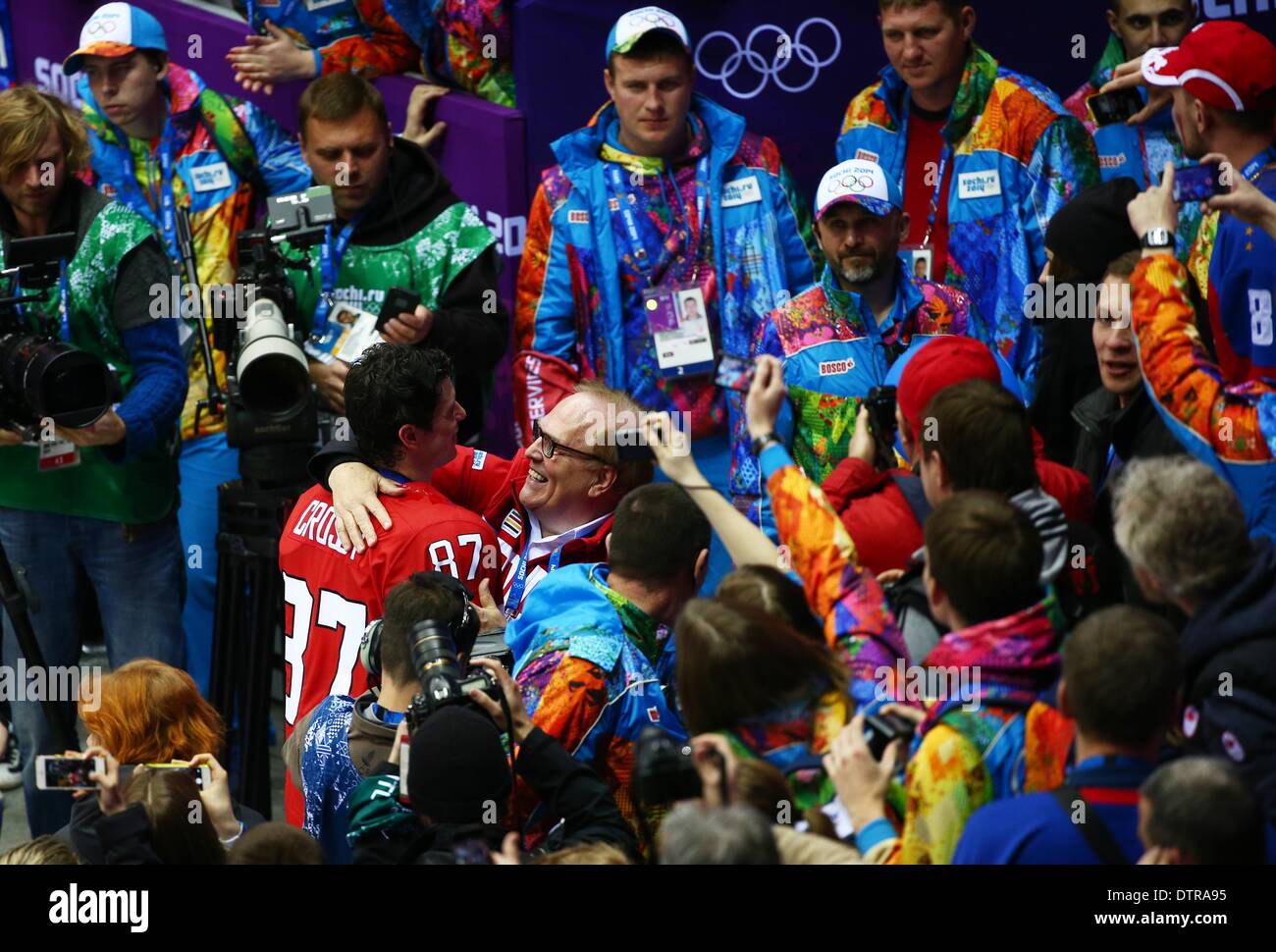 Sidney Crosby (C) of Canada hugs Marcel Aubut, president of the ...