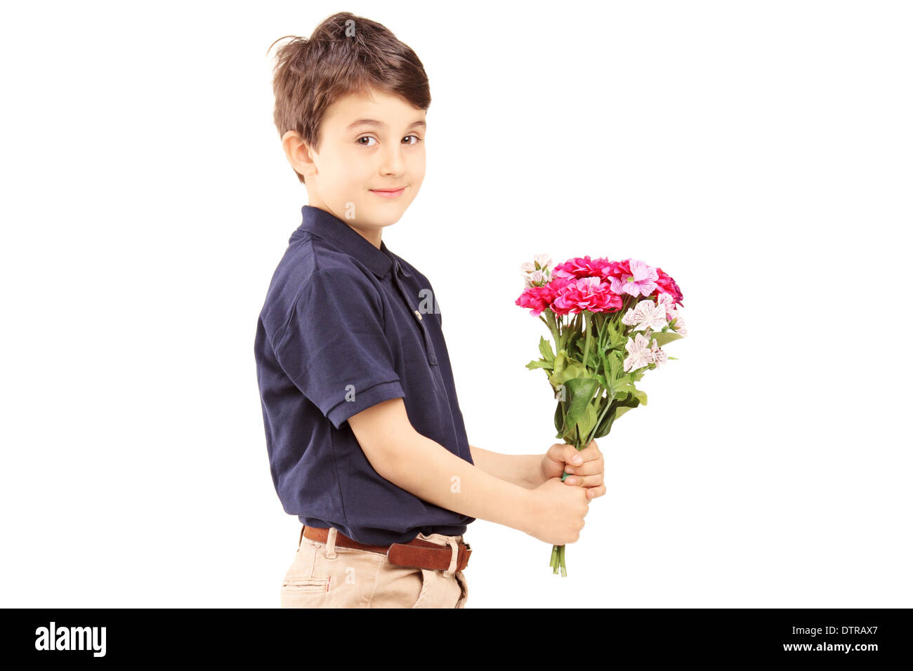 Cute little boy holding bunch of flowers Stock Photo - Alamy
