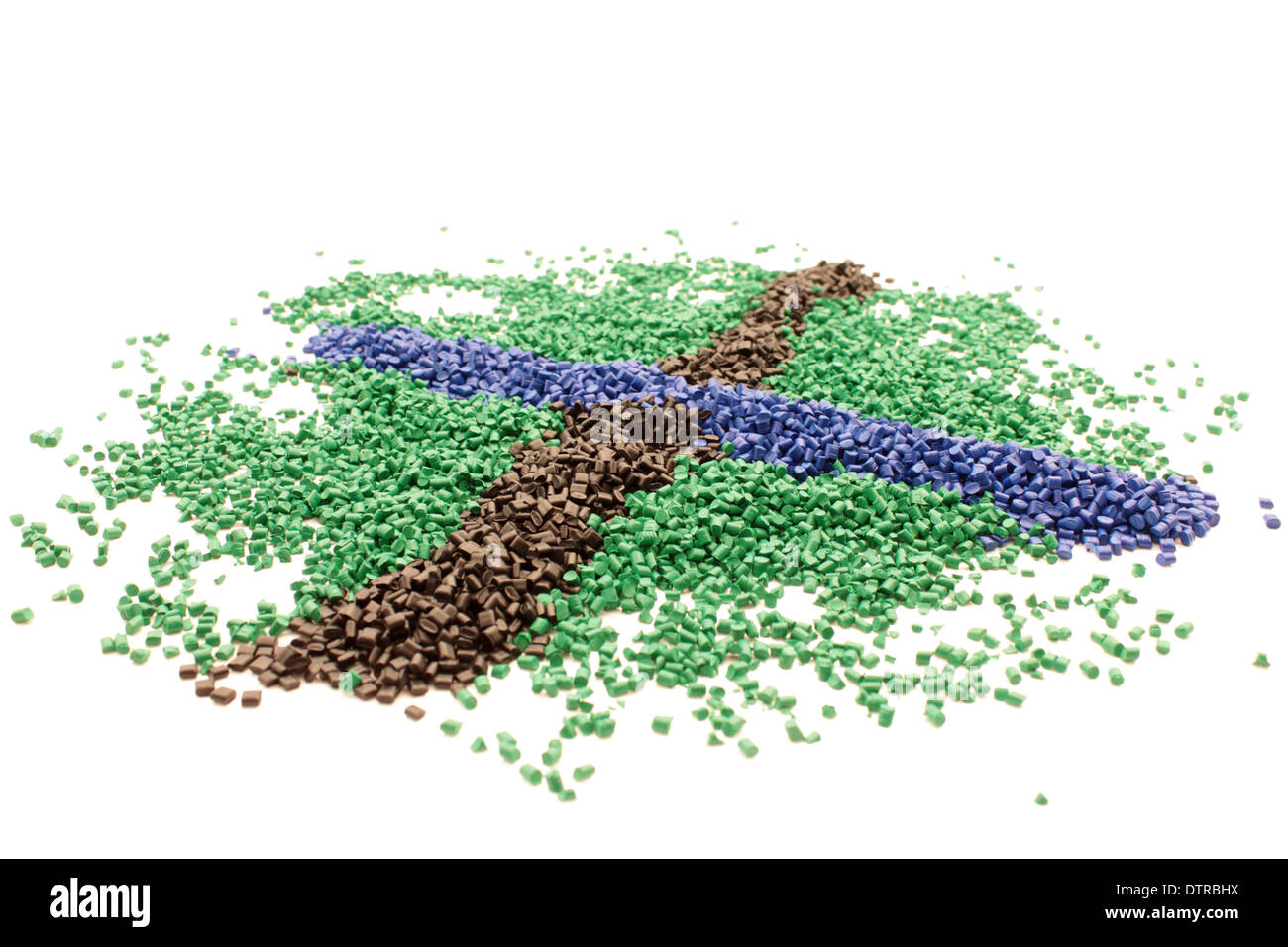 Colored plastic polymer granules in cross shape, white background Stock ...