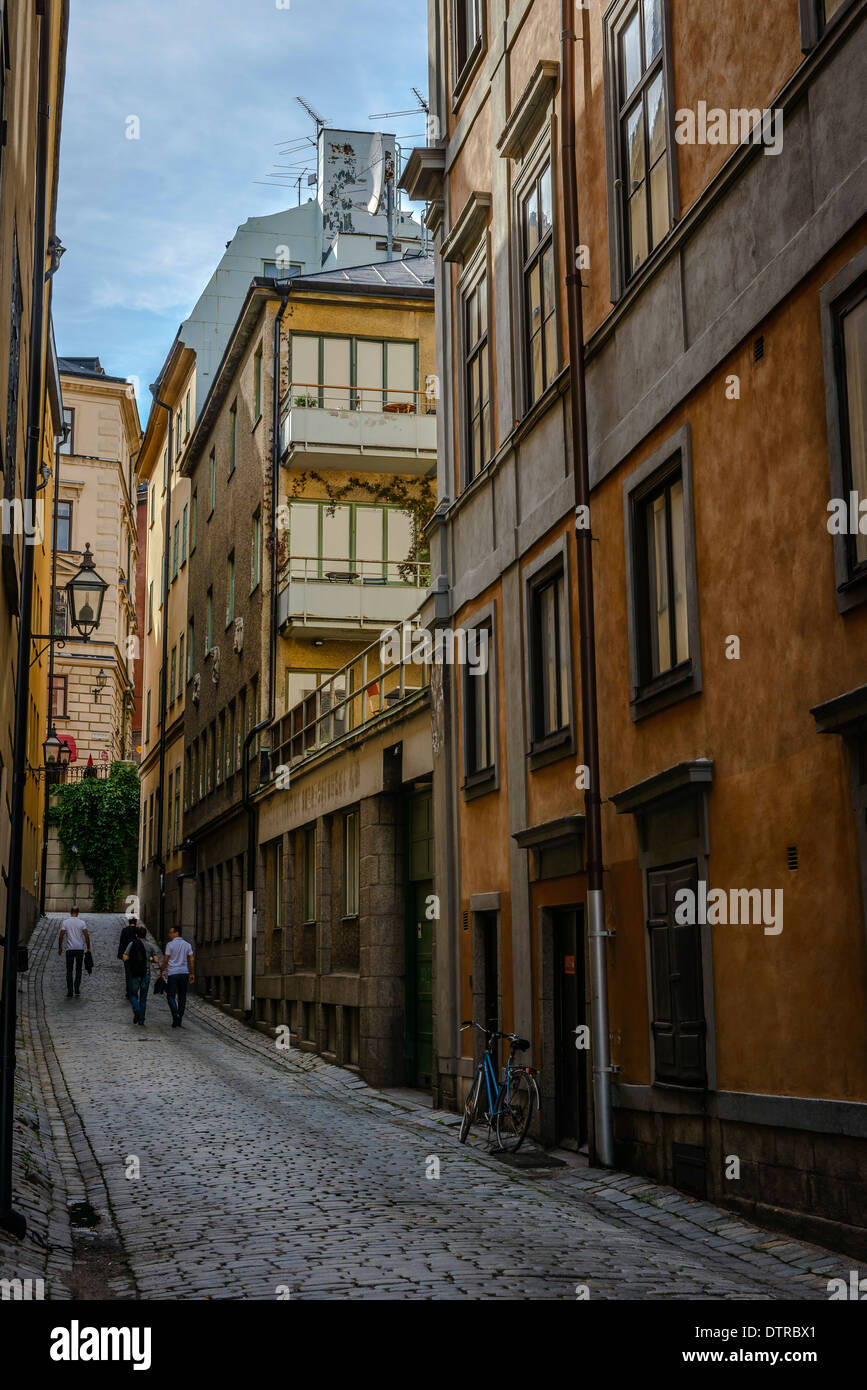 Group of friends walking in one of Stockholm's old passages Stock Photo ...