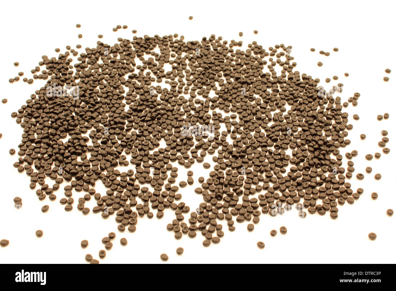 Pastic granules covering white background Stock Photo - Alamy