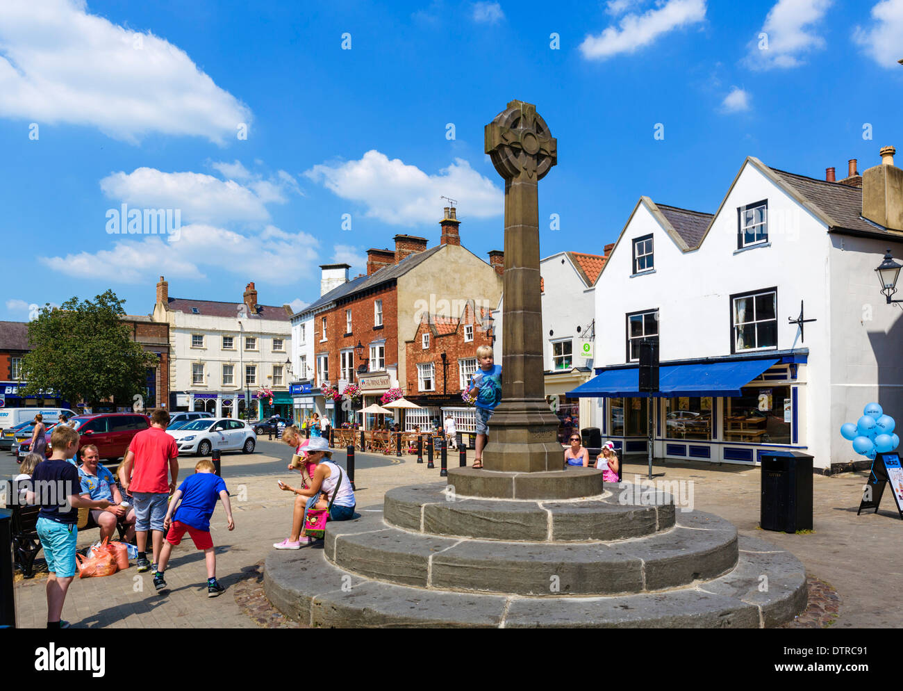 Shops and the Market Cross in the historic old Market Place ...