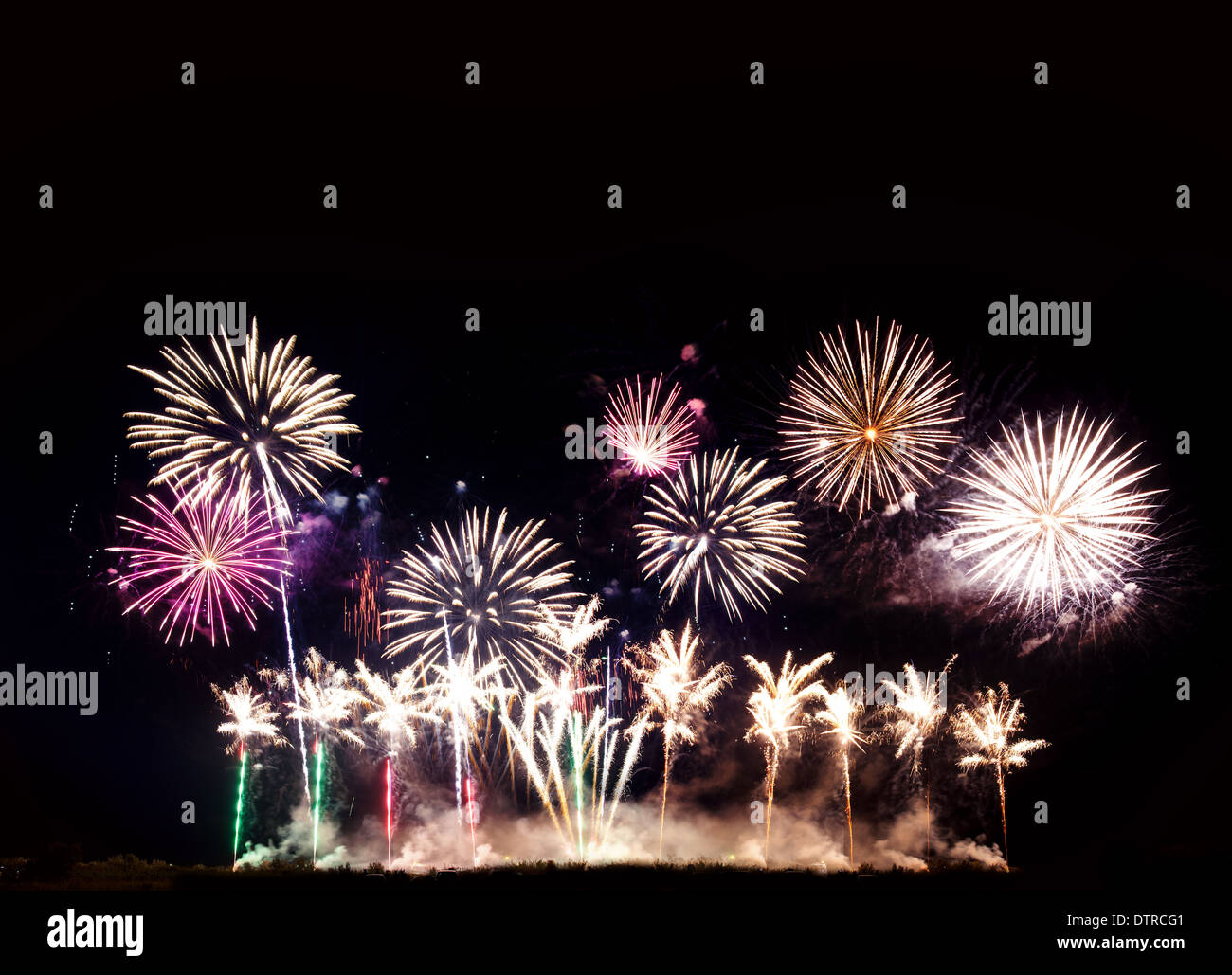Colorful fireworks of various colors over night sky Stock Photo - Alamy