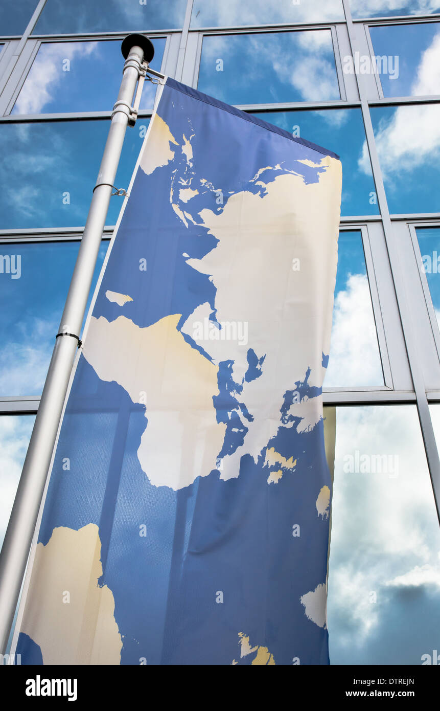 Flag With World Map In Front Of Modern Office Building Stock Photo - Alamy