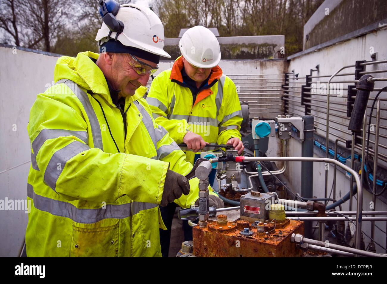 Gas engineers carrying out maintenance work at a gas pumping station in ...