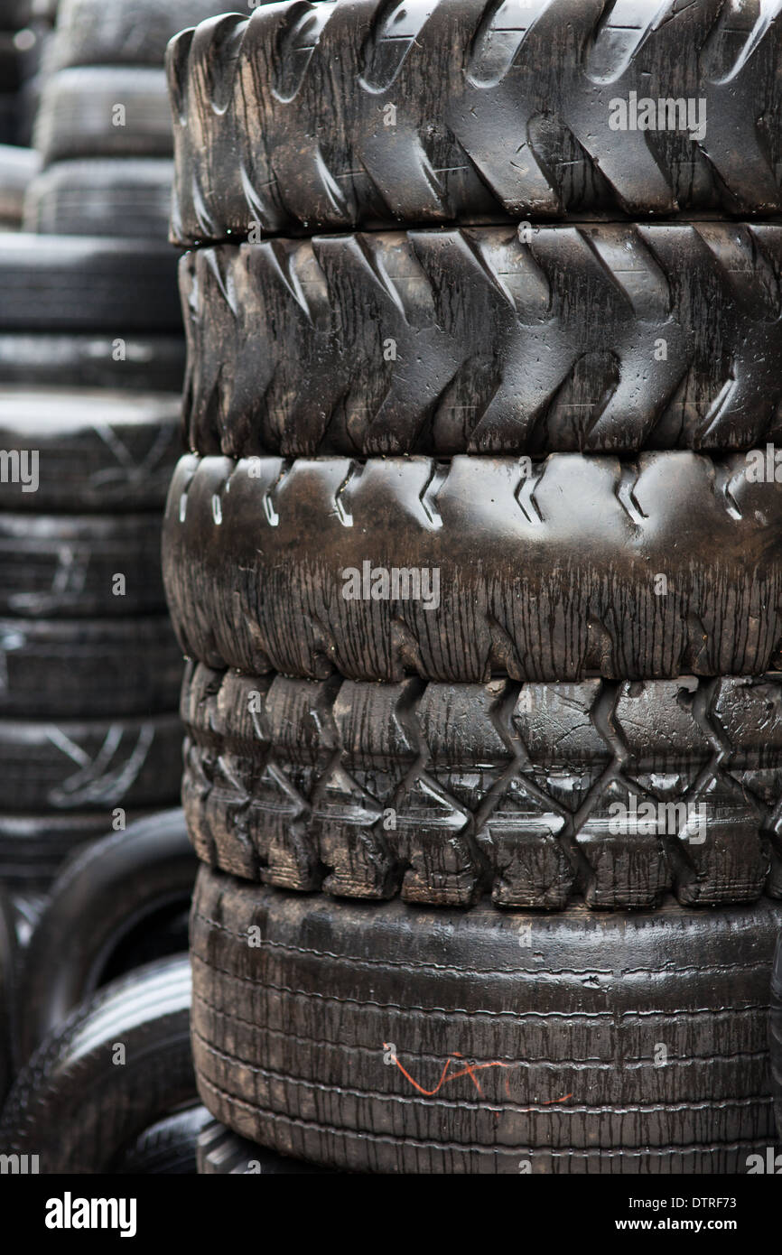 Stack of car tyres in a distribution centre Stock Photo - Alamy