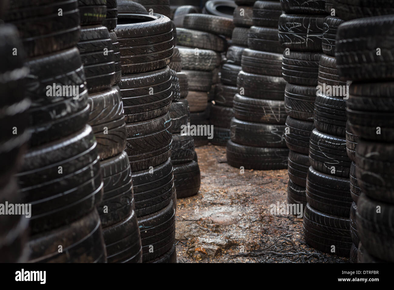 Stack of car tyres in a distribution centre Stock Photo - Alamy
