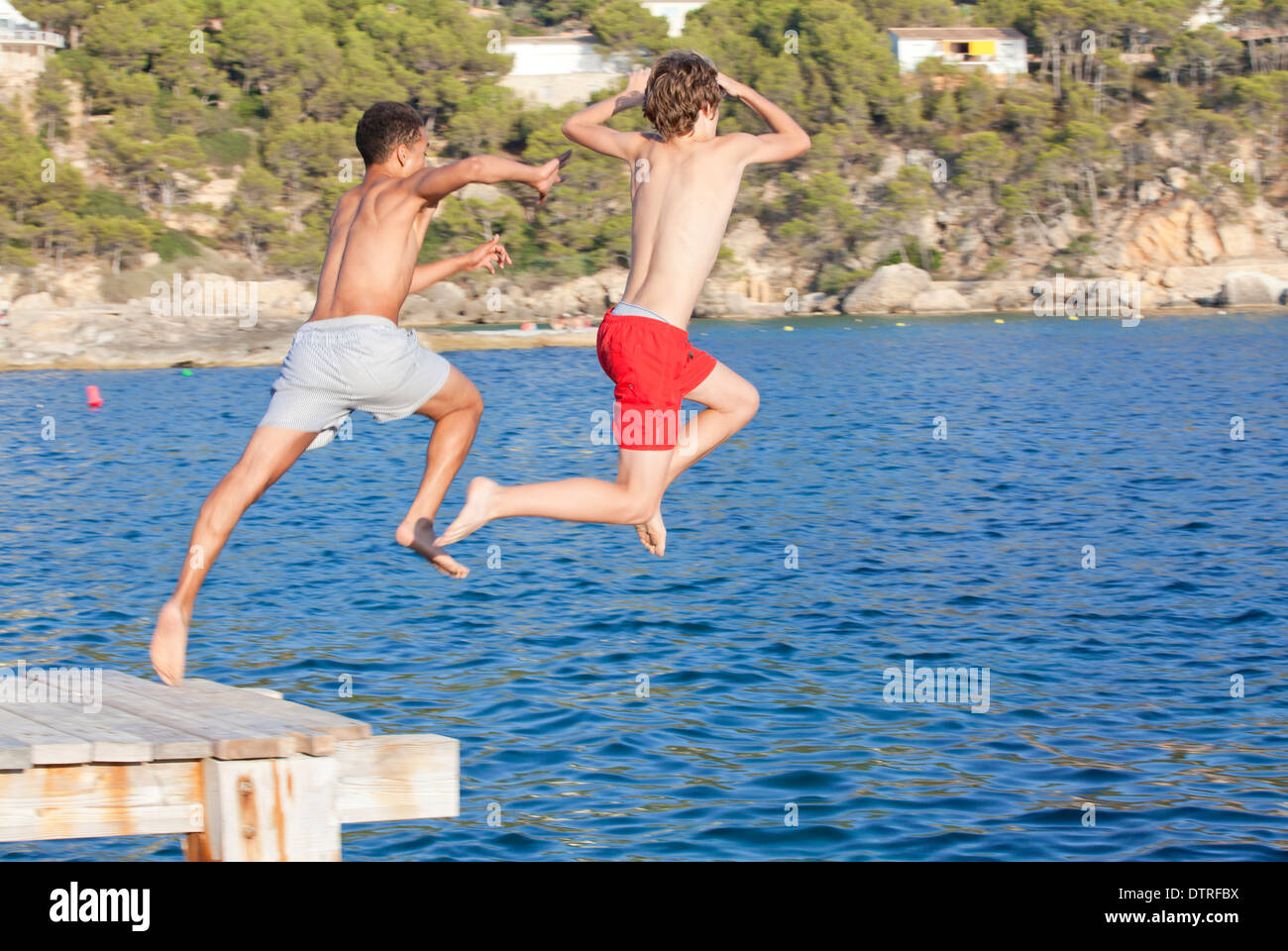 summer camp kids jumping in sea Stock Photo - Alamy