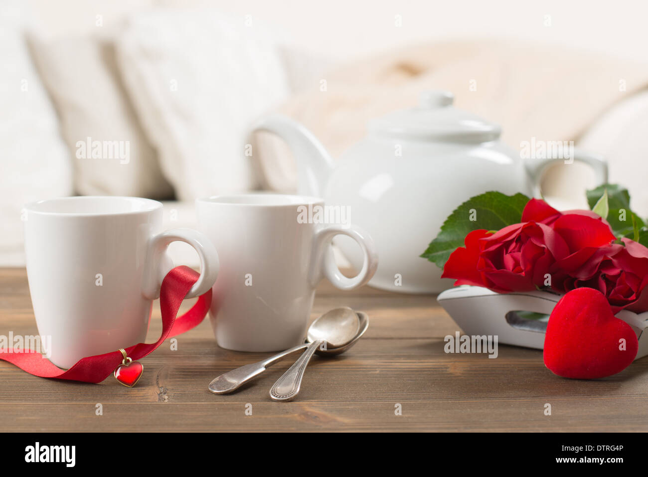 Teacups with red roses for Valentine's Day Stock Photo - Alamy