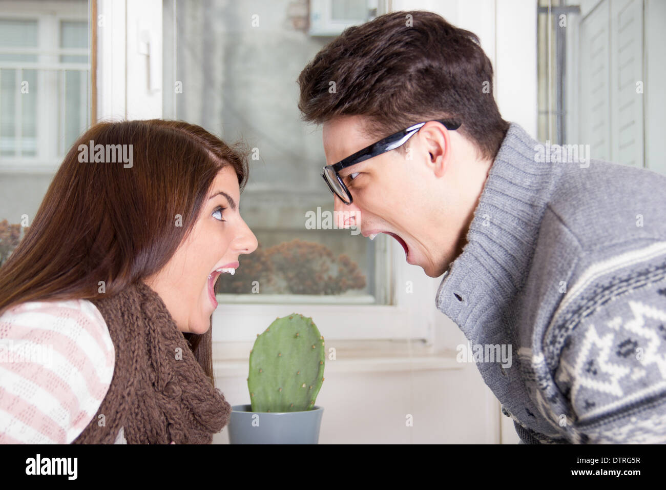 angry couple yelling at each other shouting face to face Stock Photo ...