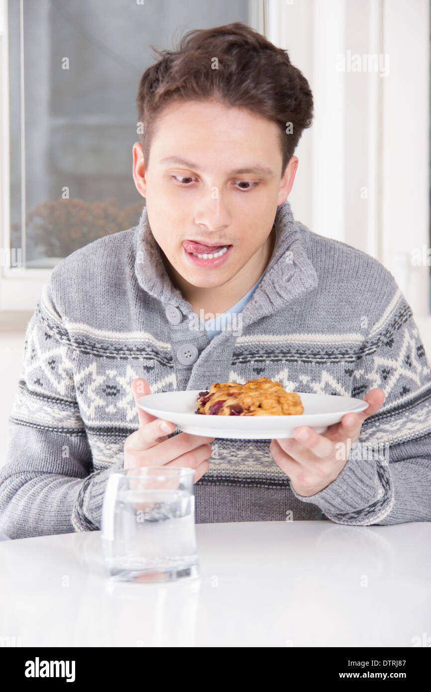 young handsome man with desire to eat dessert Stock Photo - Alamy