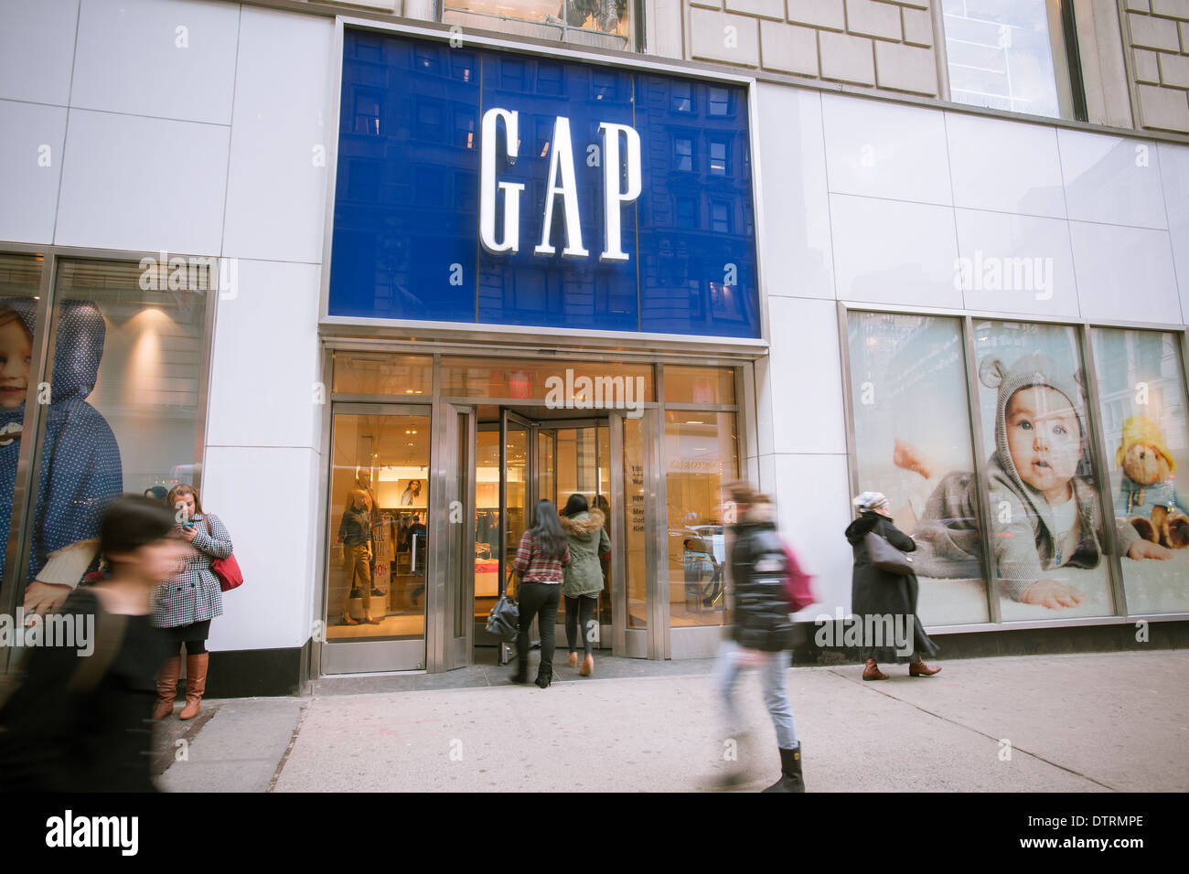 Shoppers outside a Gap store in the Herald Square shopping district in ...