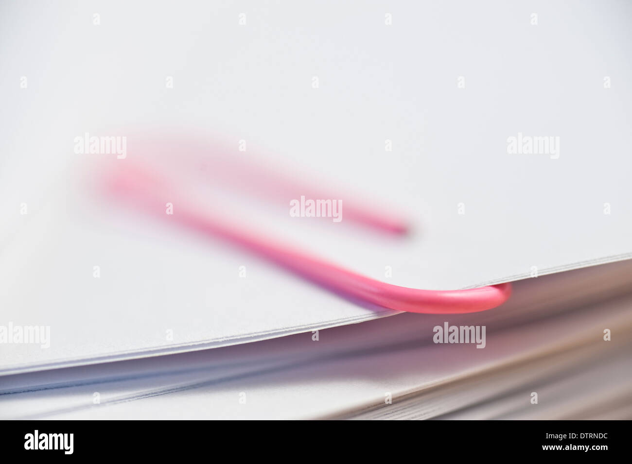 Documents stacked with multicolored paper clips close-ups Stock Photo ...