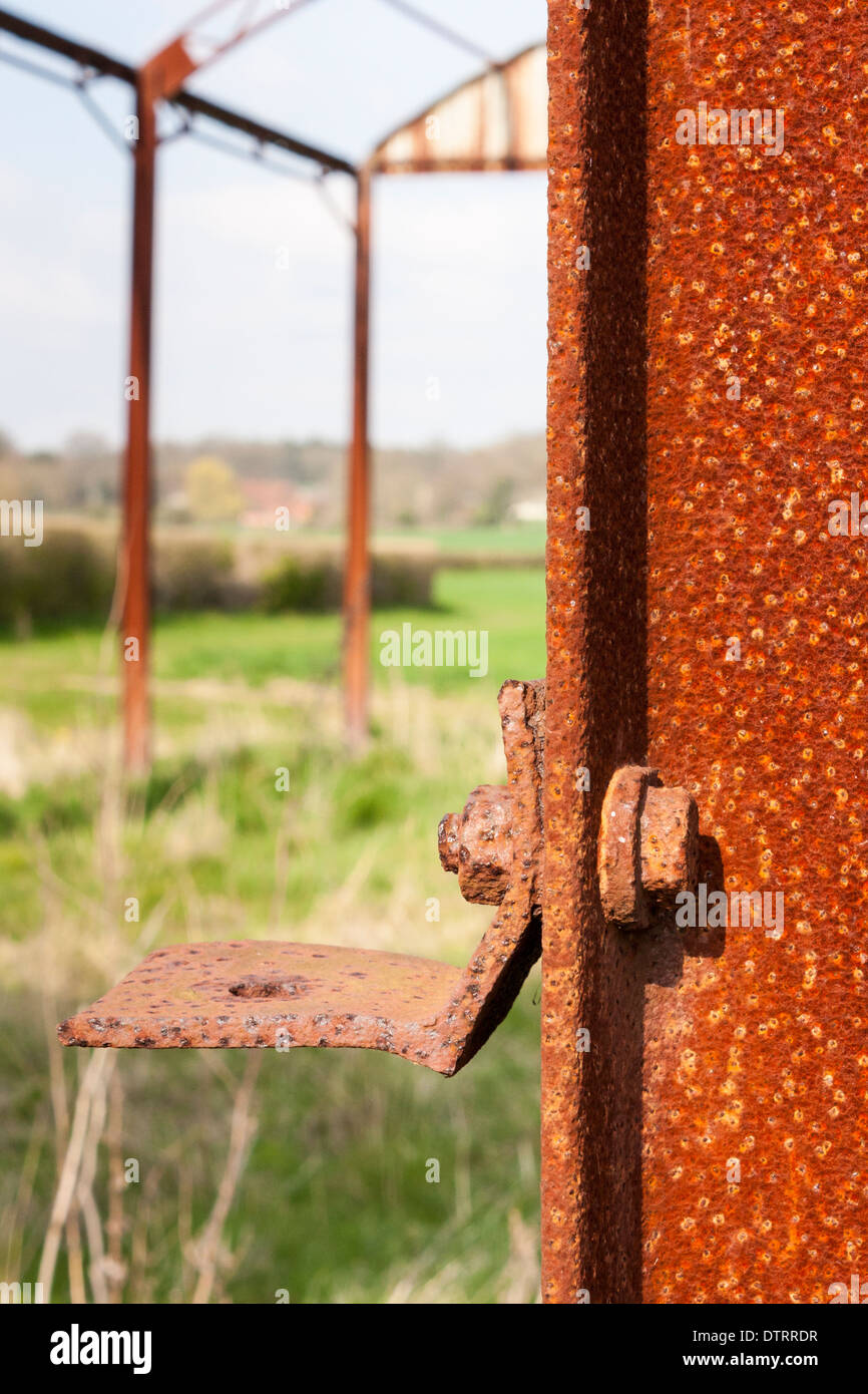 Detail of rusted bolt and bracket on a metal girder, part of a barn ...