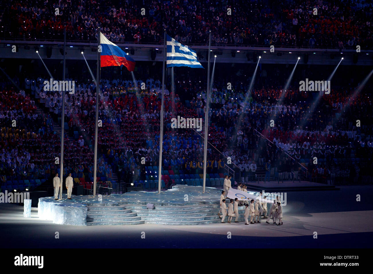 The olympic flag is carried into the stadium hi-res stock photography ...