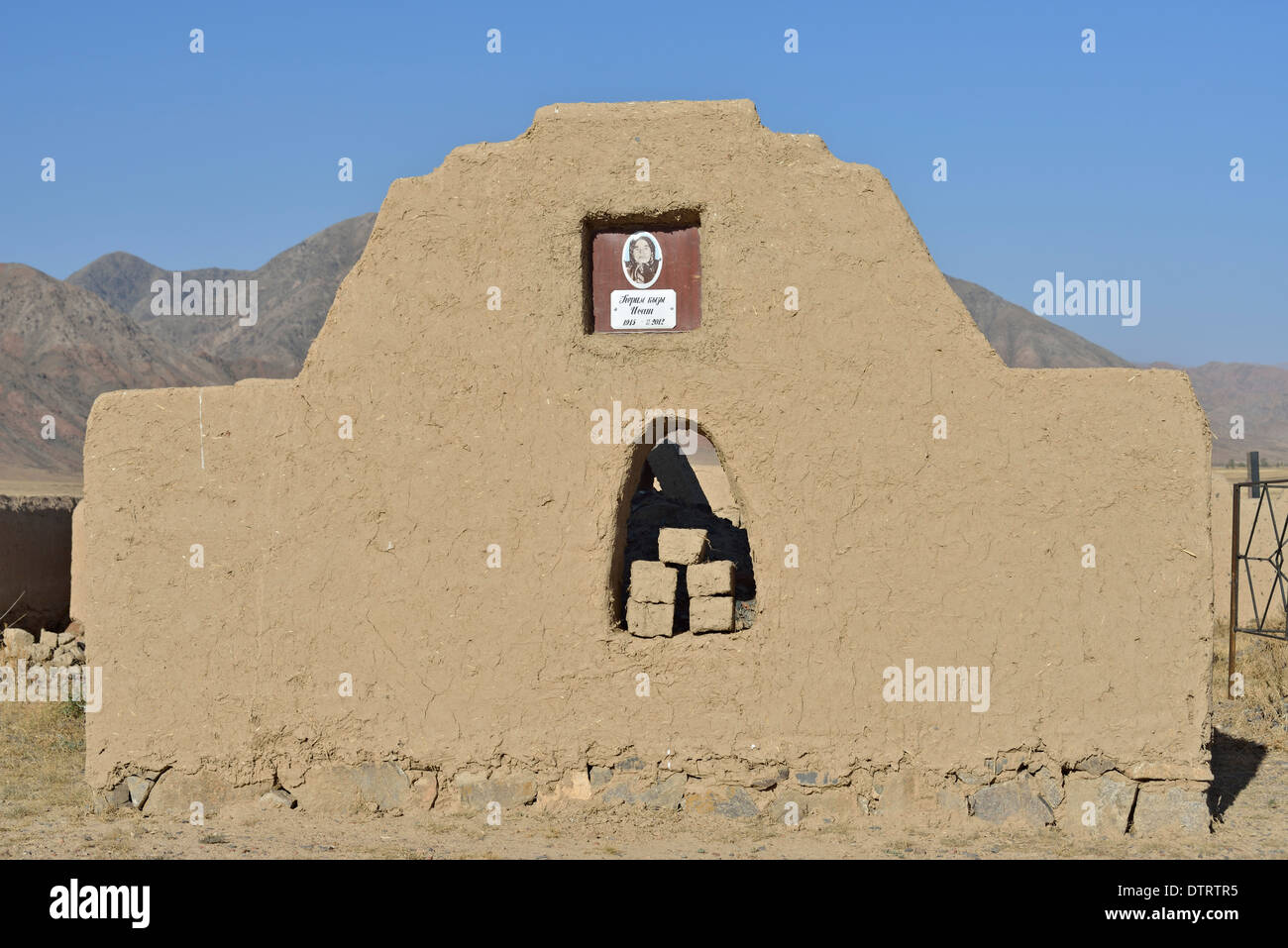 Tombs made of mud in a cemetery in village of Kara Too near Kochkor ...